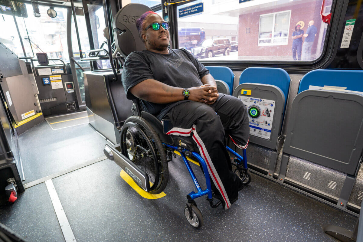 MTA piloting device to automatically secure wheelchairs in place on buses